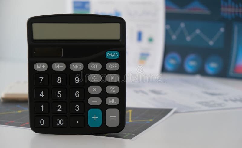 A Close-up Calculator on a Table with Papers Stock Photo - Image of ...