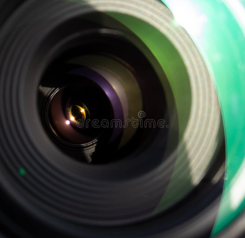 Close Up of a Camera Lens, with Glass Elements Reflecting Bright and ...