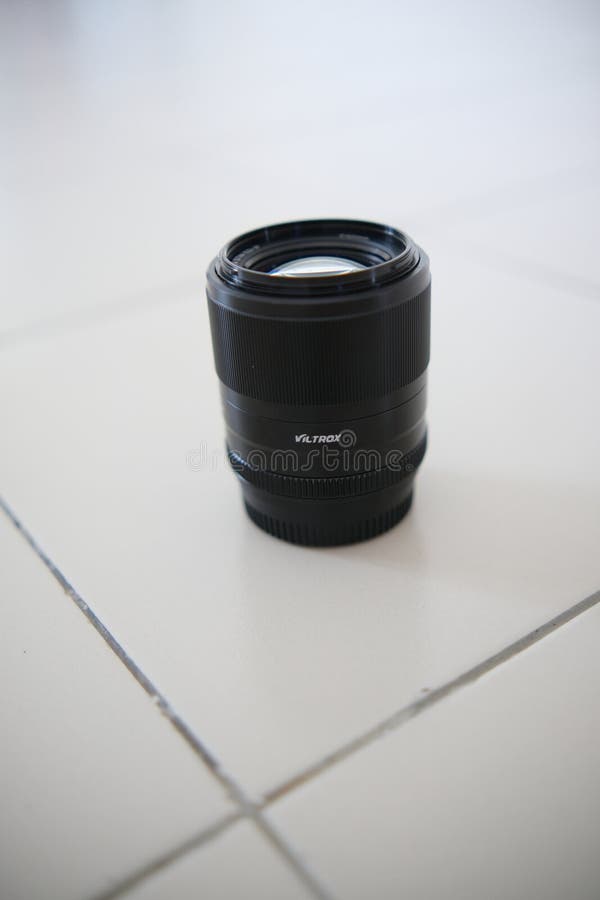 A Close Up of a Camera Lens on a Tiled Floor Stock Image - Image of ...