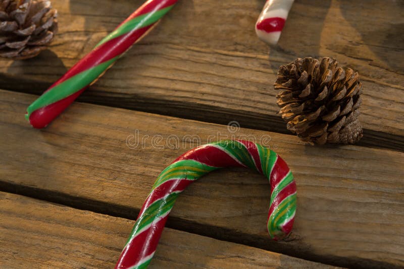 Close Up of Candy Canes and Pine Cones on Table Stock Image - Image of ...