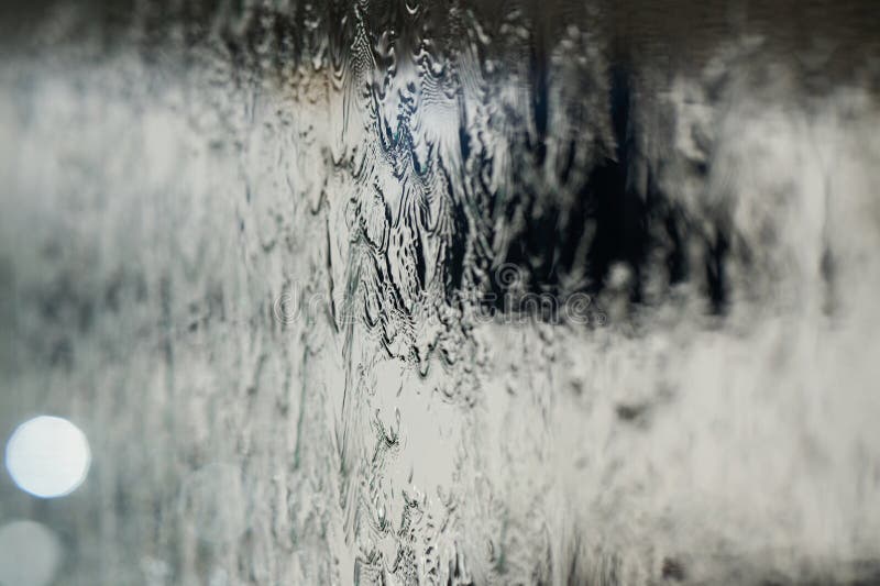 In a Close-up Capture, the Texture of Glass through Which Water Flows ...
