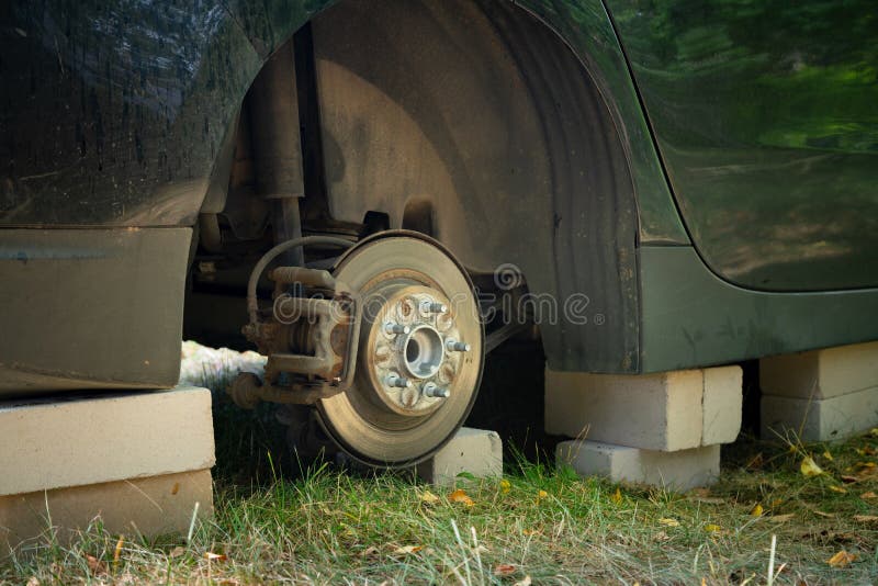 Close Up of Car on Bricks Outside. Concept of Stolen Vehicle Wheels ...