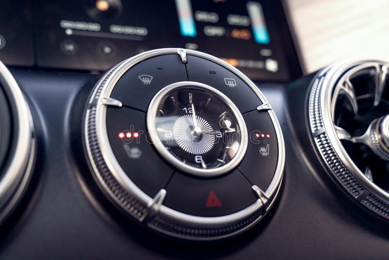 Close Up of a Car Clock, Control Unit and Buttons for Seat Heating and ...