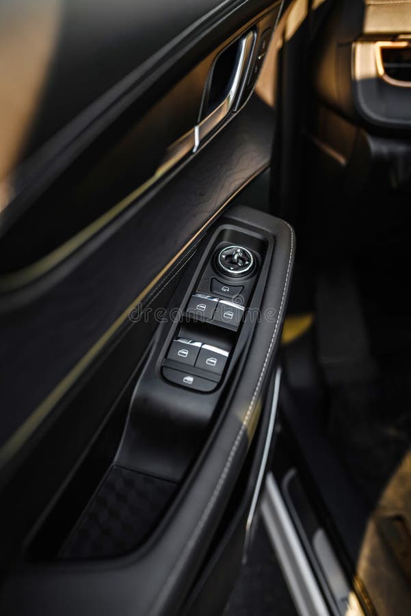 Close-up of Car Door Panel Featuring Control Buttons for Windows and ...