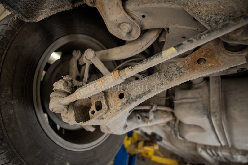 Close-up of Car Parts on a Lift in a Garage. Stock Image - Image of ...