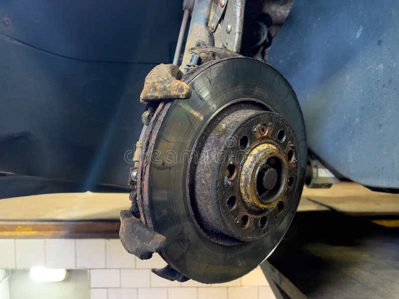 Close-up of a Car S Brake Rotor and Caliper Showing Rust and Wear Stock ...