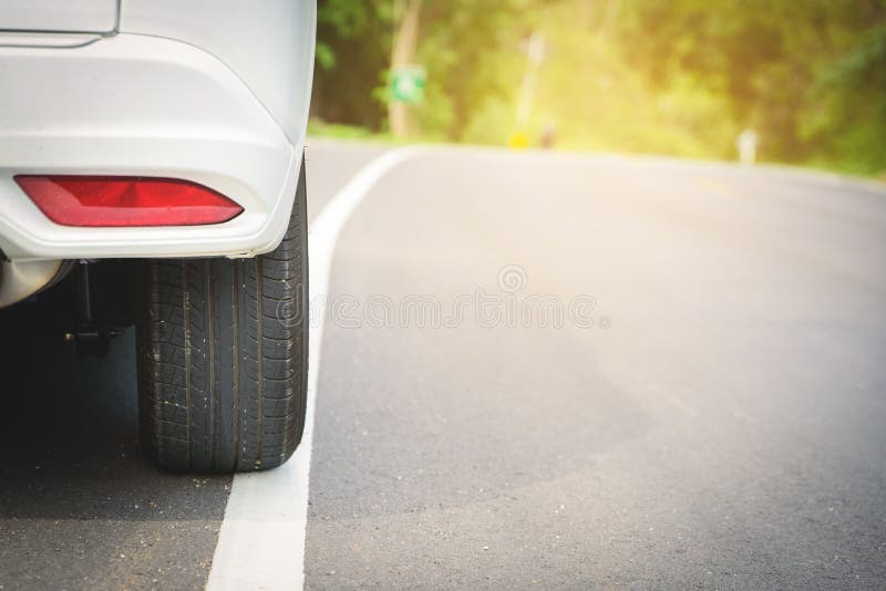 Close Up of a Car Wheel on the Ground Road with Sun Light Stock Image ...