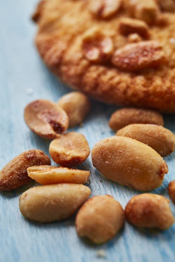 Close-up of Caramelized Roasted Peanuts on Blue Wooden Background Stock ...