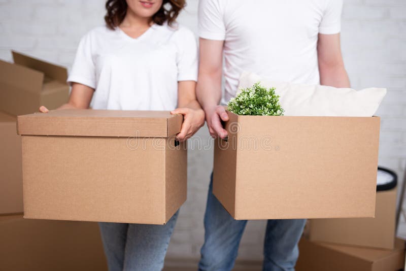 Close Up of Cardboard Boxes in Young Couple Hands Stock Photo - Image ...