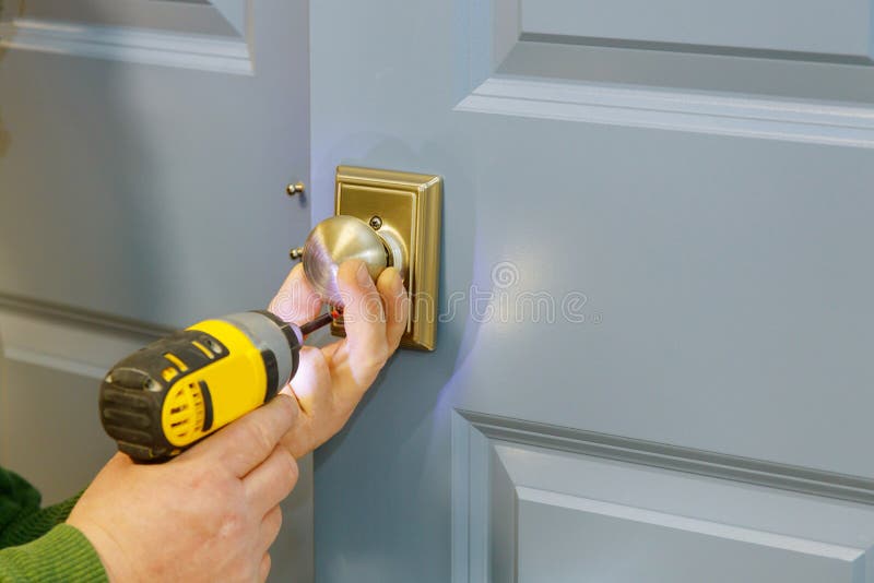Close-up Carpenter Hands with Doorlock during Lock Process Installation ...
