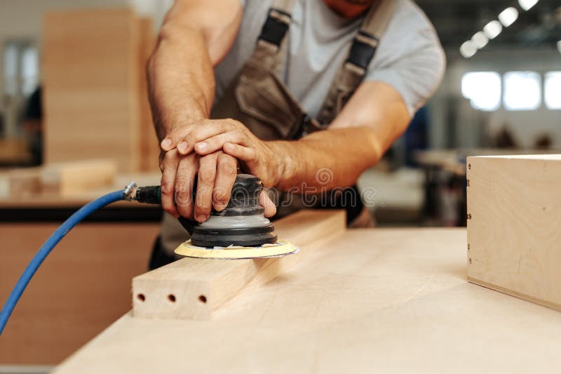 Close Up of Carpenter Hands Sanding Wood with Orbital Sander at ...