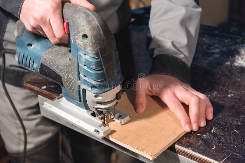 Close Up of Carpenter`s Hands Working Power Tools for Processing Wood ...