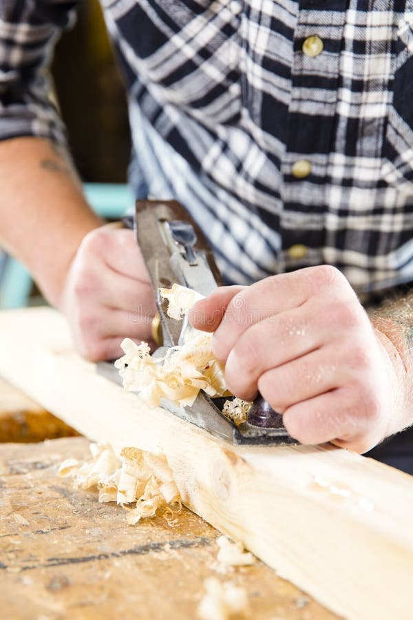 Close-up of Carpenter Work with Plane on Wood Plank Stock Photo - Image ...