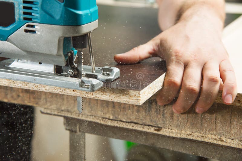 Close-up Carpenter Working with an Electric Jigsaw Stock Image - Image ...