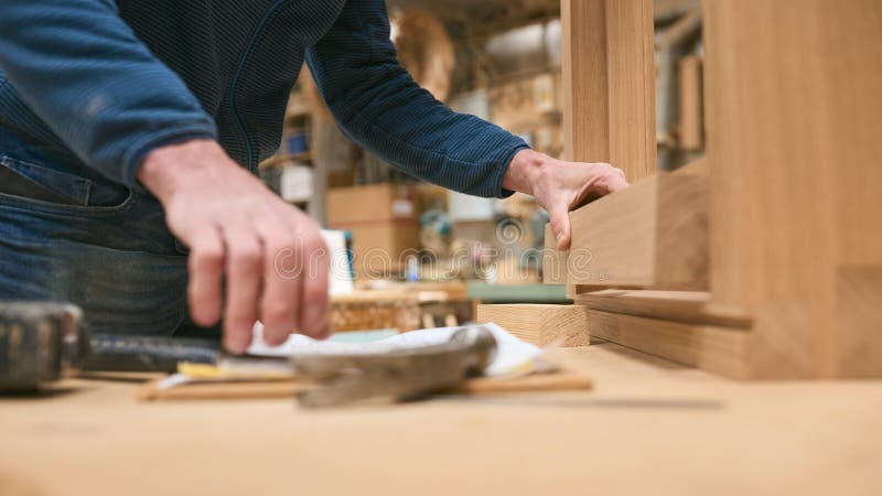 Close Up of Carpenter in Workshop Gluing Wood To Window Frame Stock ...