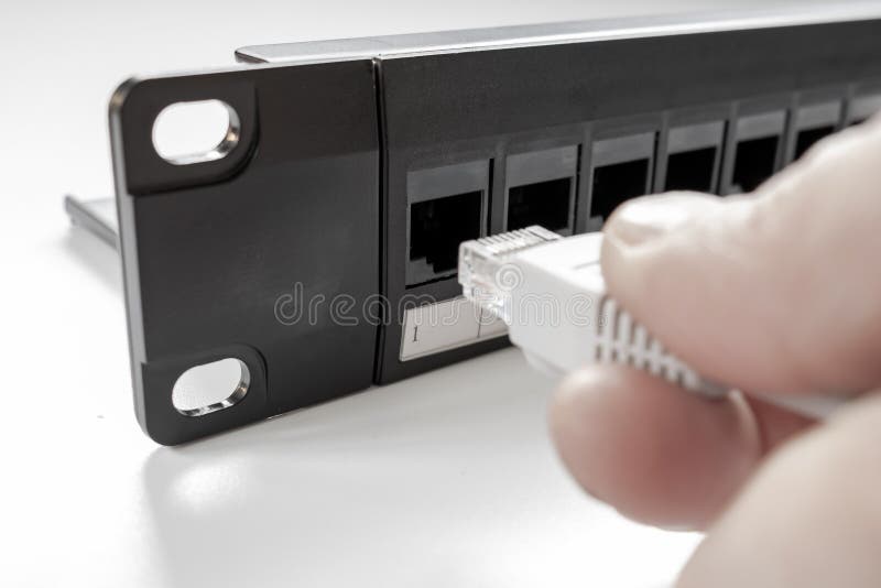 Close-up of a Cat5e 24-Port Patch Panel Showing an Ethernet Patch Lead ...