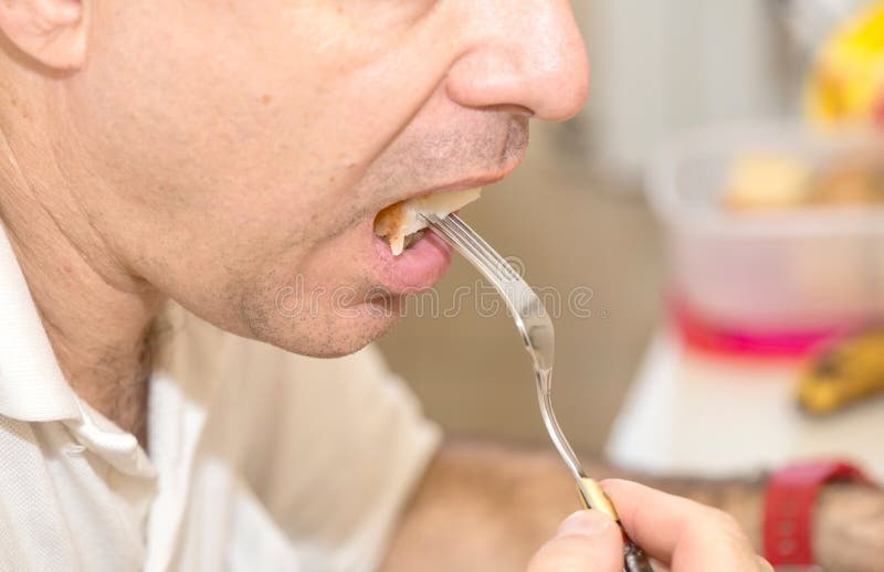 Close Up of a Caucasian Man Mouth Eating with Fork Stock Photo - Image ...