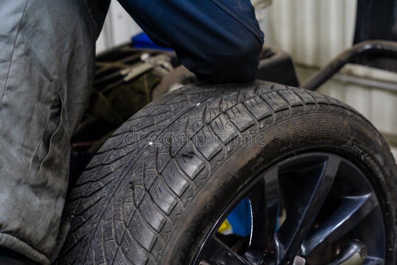 Close Up of Changing Car Tyre. Car Tire Fitting Stock Photo - Image of ...
