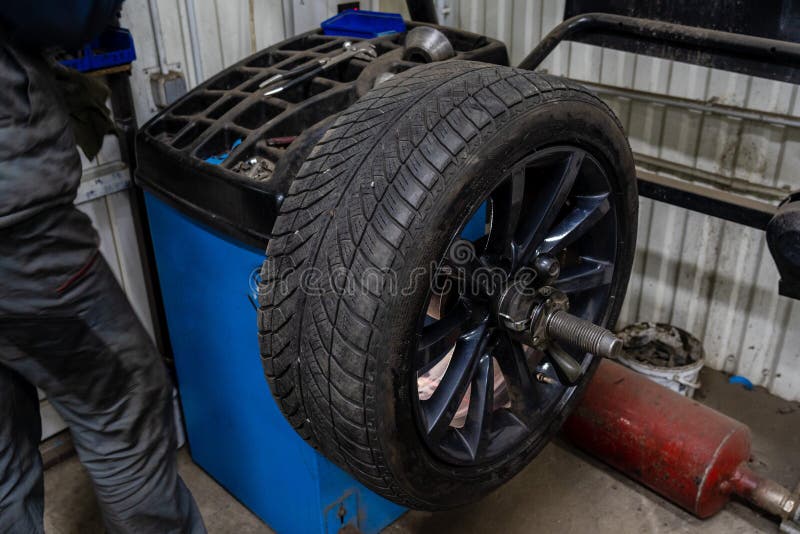 Close Up of Changing Car Tyre. Car Tire Fitting Stock Photo - Image of ...