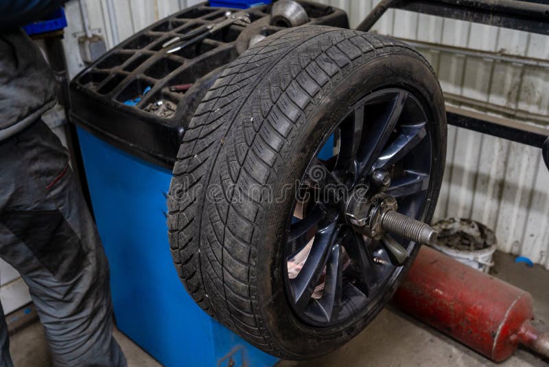 Close Up of Changing Car Tyre. Car Tire Fitting Stock Photo - Image of ...