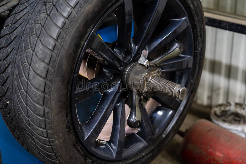Close Up of Changing Car Tyre. Car Tire Fitting Stock Image - Image of ...