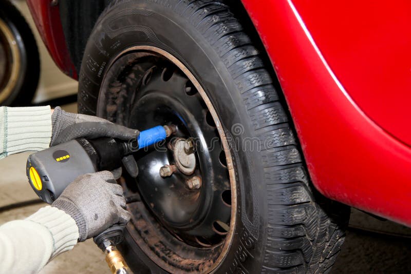Close-up of Changing Wheel on Car - with Pneumatic Stock Image - Image ...