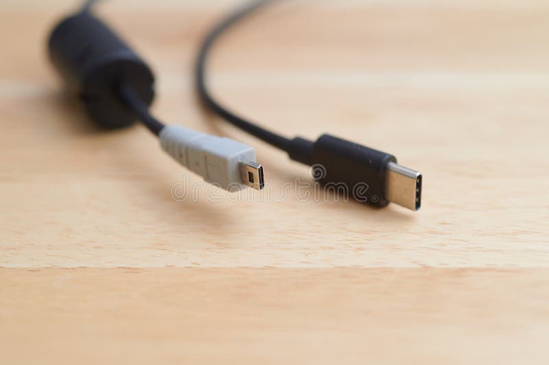 Close Up of Charging Cables Lying on a Table Stock Image - Image of ...