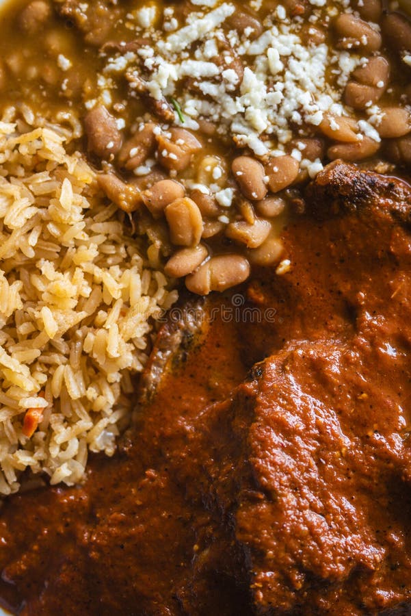 Close Up of Charro Beans and Rice with a Side of Mole Stock Image ...