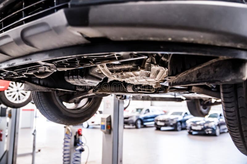 Close Up of Chassis or Wheels or Motor on Lift on Service Station ...