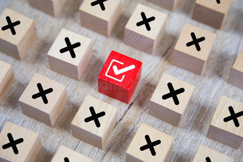 Close-up Check Mark on Cube Wooden Toy Block Stack with Cross Symbol ...