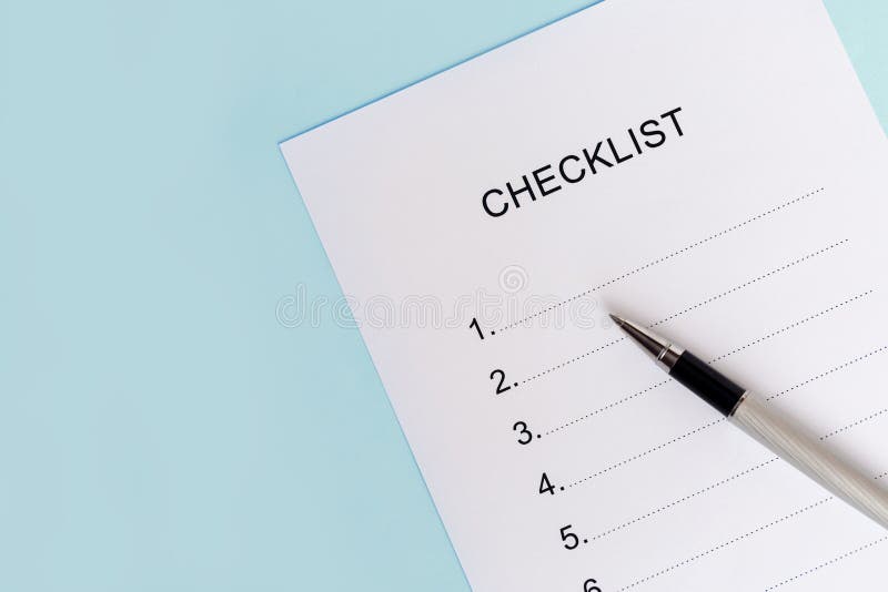 Close-up of on Checklist with Pen on a Blue Background Stock Photo ...