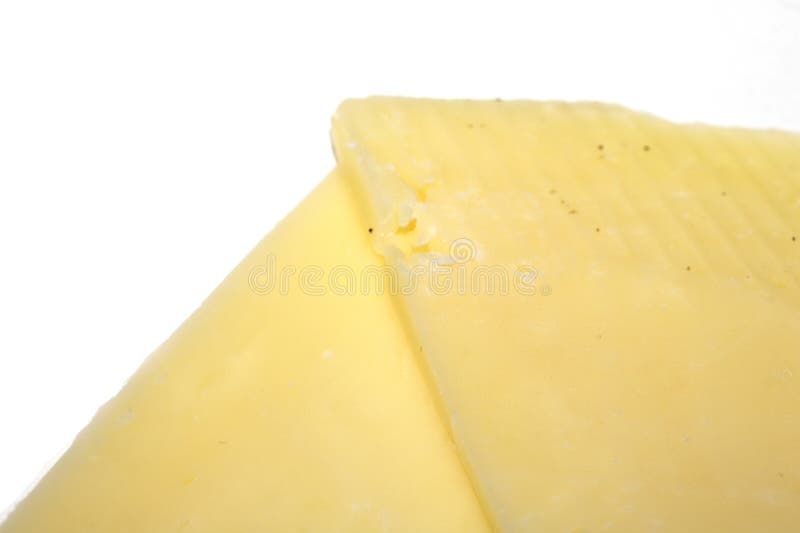 Close Up of Chedder Cheese Slices on a White Background Stock Photo ...
