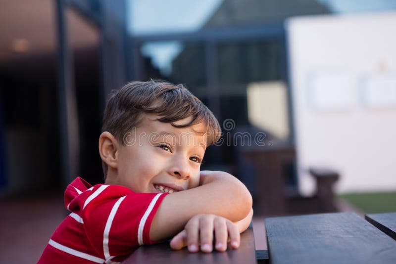 Close Up of Cheerful Boy Looking Away Stock Photo - Image of sitting ...