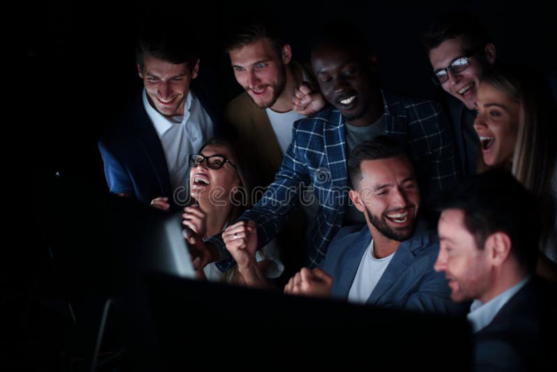 Close Up.Cheerful Business People Look at the Computer Screen Stock ...