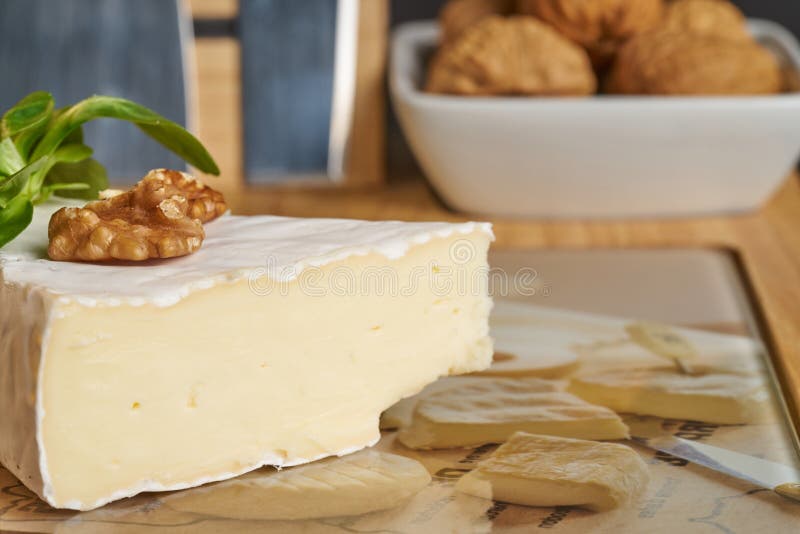 Close-up of Cheese and Walnuts on Wood Cheese Board Stock Photo - Image ...