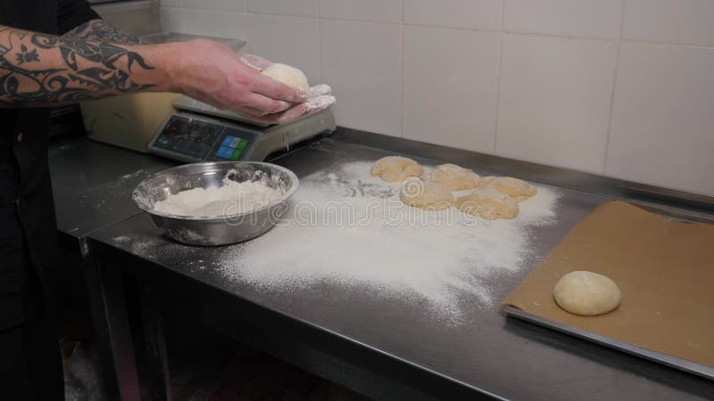 Close-up of a Chef Forming Round Burger Buns from Dough in an ...