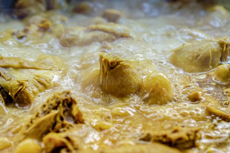 Close Up of Chicken Cooked in the Pan with Boiling Oil. Stock Photo ...