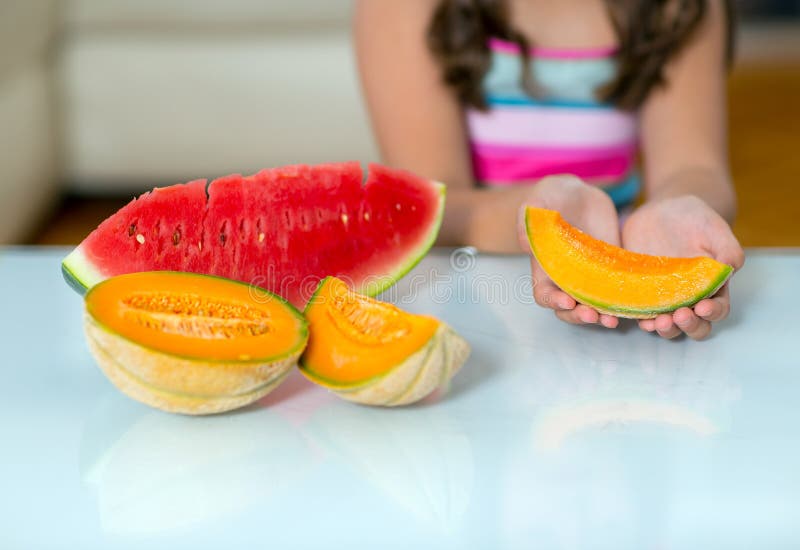 Close-up of Child Hand Holding a Watermelon and Melon Stock Photo ...