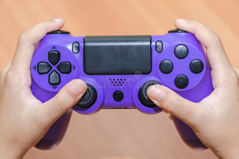Close Up of Child Hands Playing the Video Game. Shot of a Child Holding ...