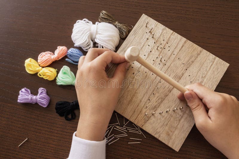 Close-up of a Child Hands Using a Hammer. Practicing Precision ...