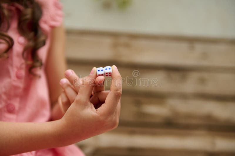 Close-up of Child S Hand Holding Two Dice in a Playful and Engaging ...