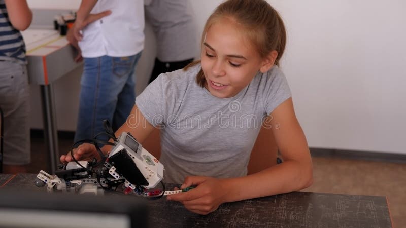 Children Control Cars Robots Assembled from a Constructor in a Robotics ...