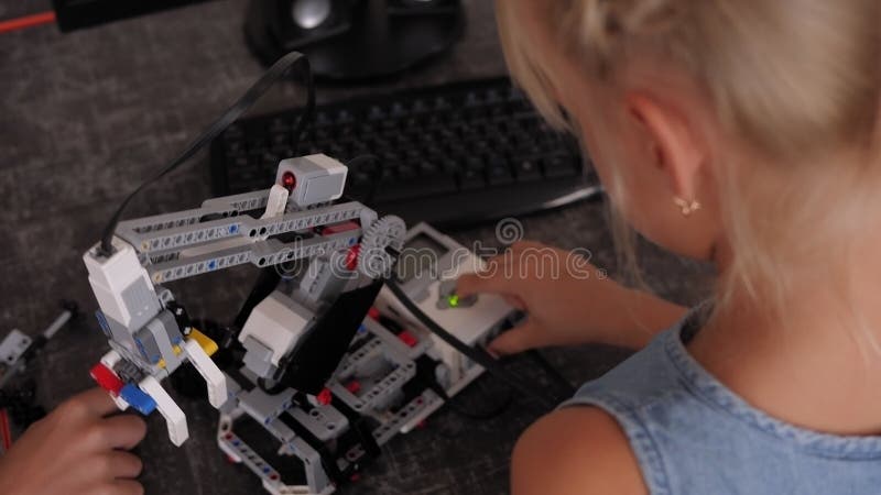 Children Control Cars Robots Assembled from a Constructor in a Robotics ...