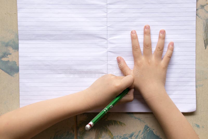 Close Up Children are Holding a Pencil and Writing. Stock Photo - Image ...