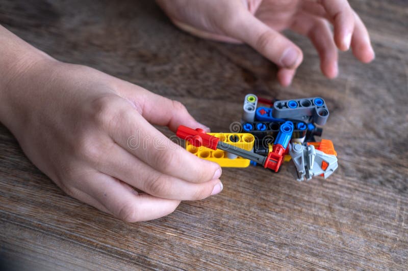 Close-up of Children S Hands Creating Construction from Pieces, Figure ...