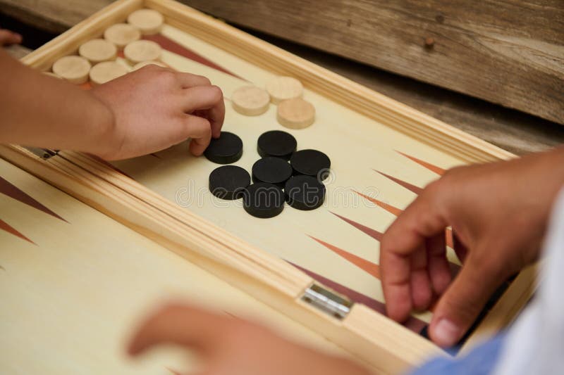 Children Playing Backgammon Together Indoors, Engaging in a Fun ...