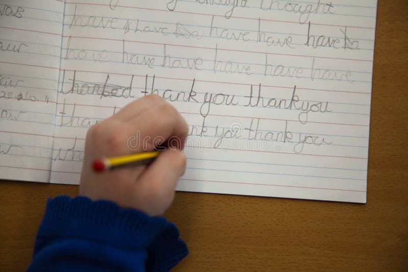 Close Up of a Childs Hand Practicing Handwriting in School Stock Photo ...