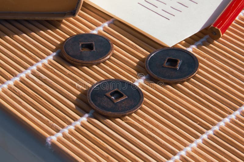 Close-up of Chinese Coins, Together with a Pencil and Paper and Stock ...