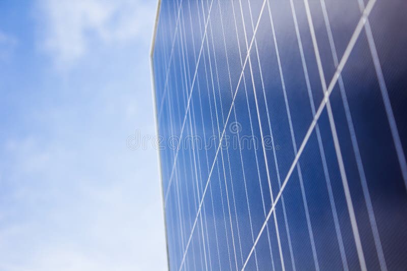 Close Up of a Circular Solar Panel Against an Electric Blue Sky Stock ...