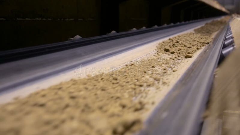 Conveyor with Soil. Clay Goes through Transporter in a Mining Factory ...